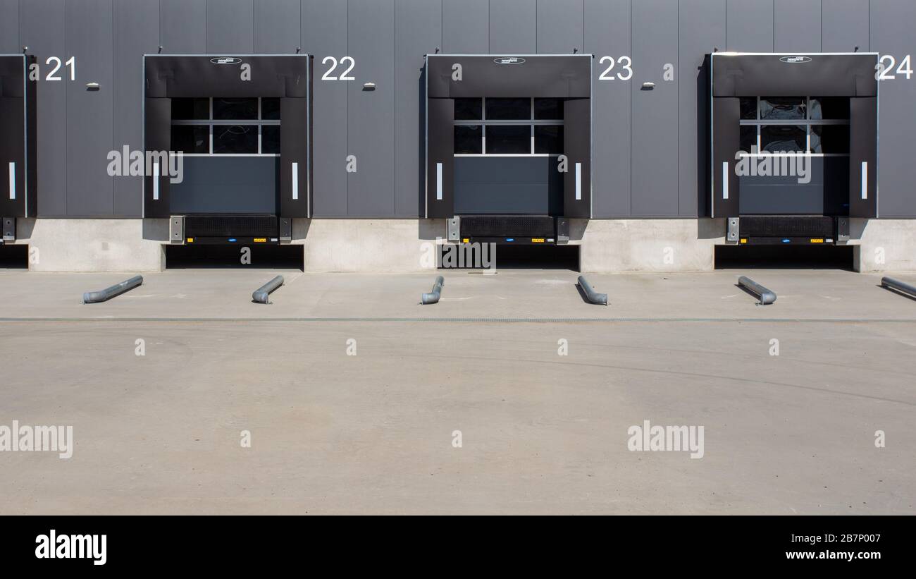Outdoor view of loading docks of a warehouse with gray facade Stock ...