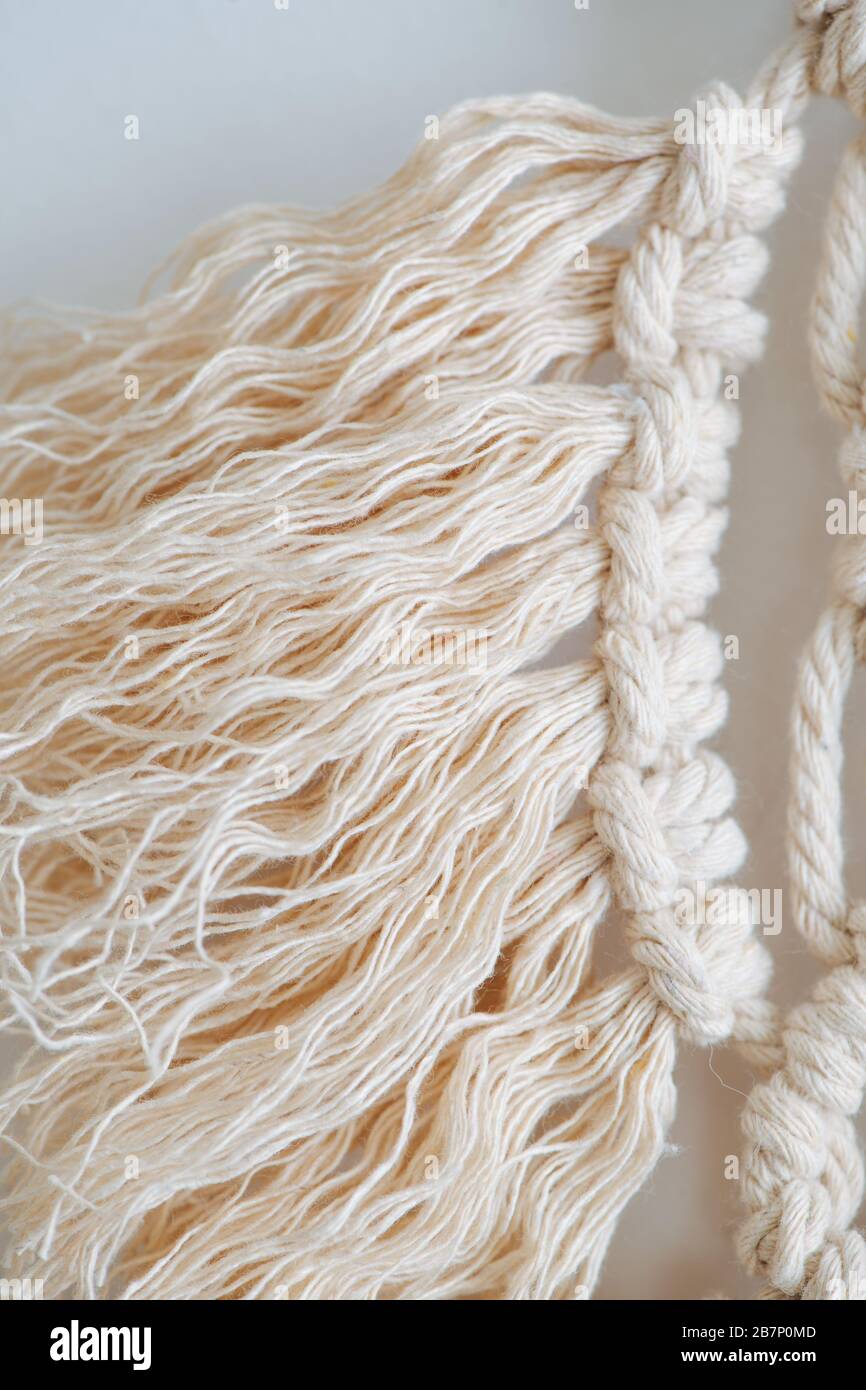 beautifully tied knot of white rope macrame Stock Photo - Alamy