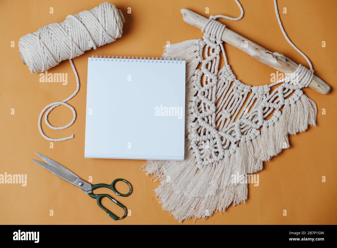 Notepad for your text, lying on the table with macrame Stock Photo - Alamy