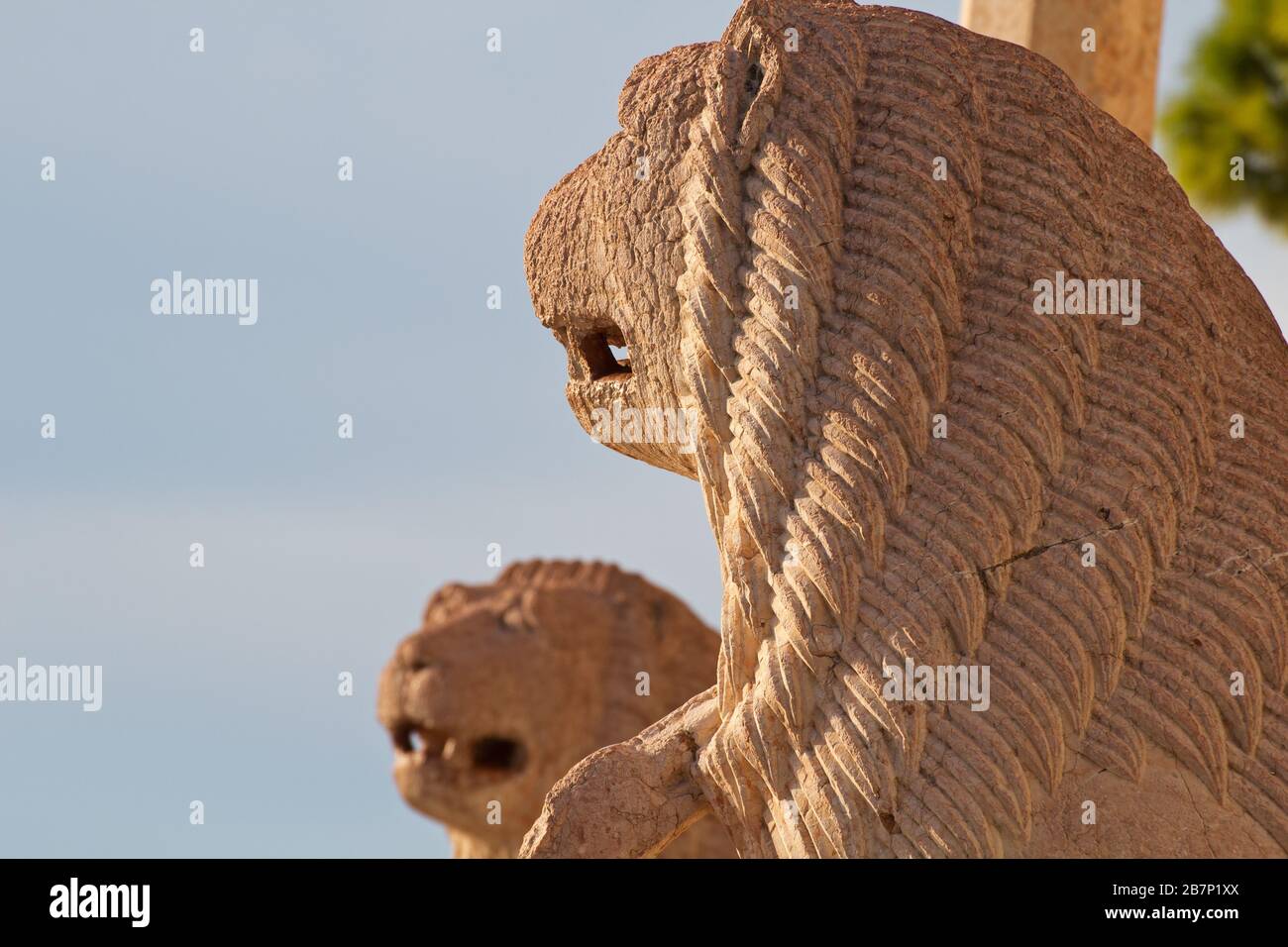 Red marble lions sculptures at the base of the entrance portico ...