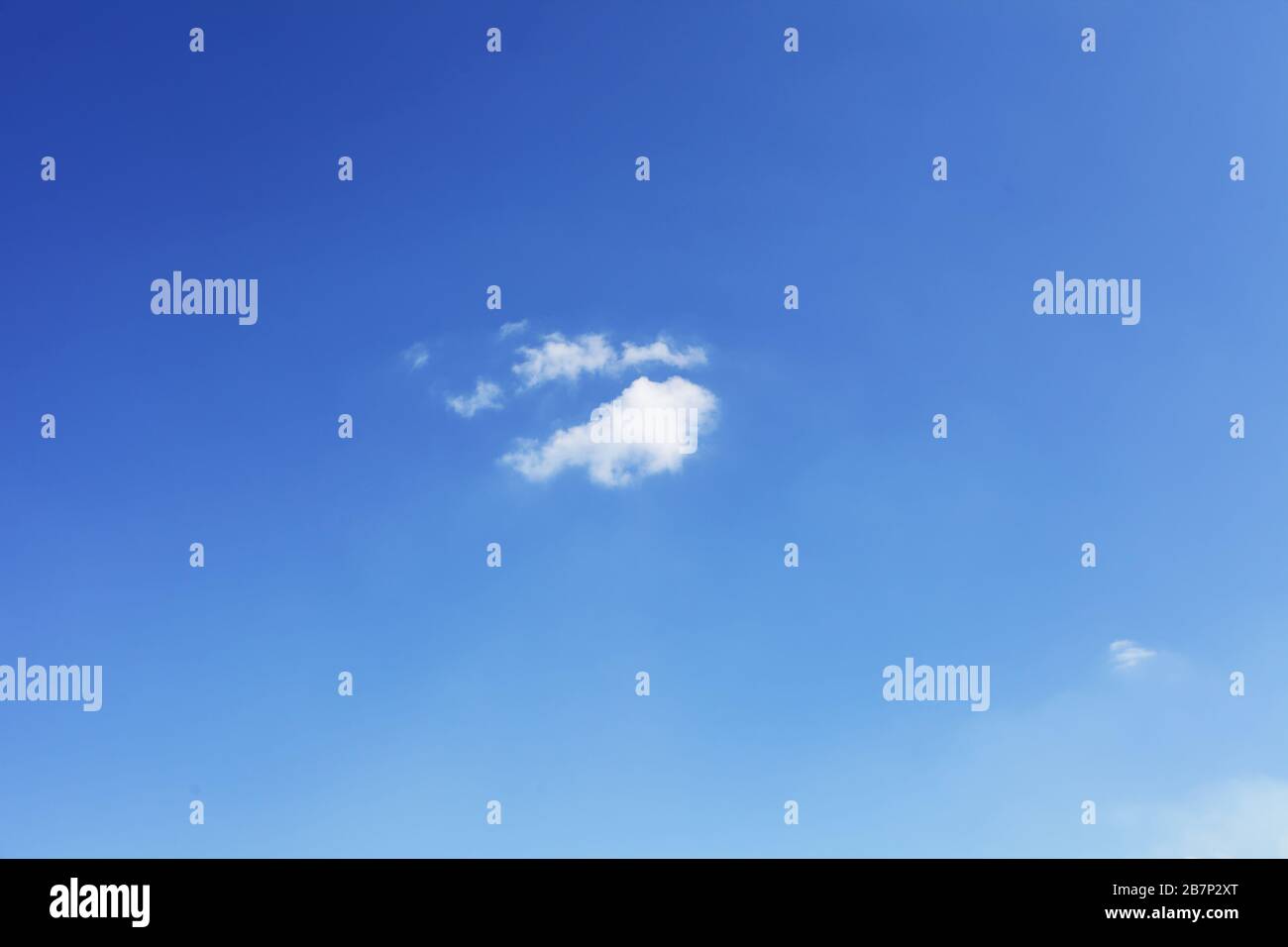 small white cloud against blue sky, background Stock Photo - Alamy