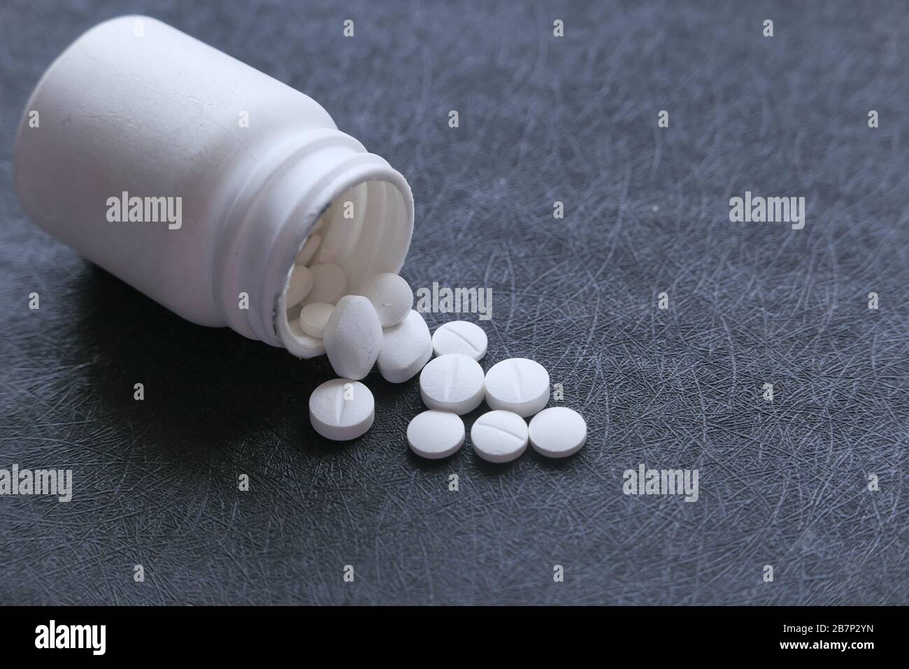White color pills spilling from hi-res stock photography and images - Alamy