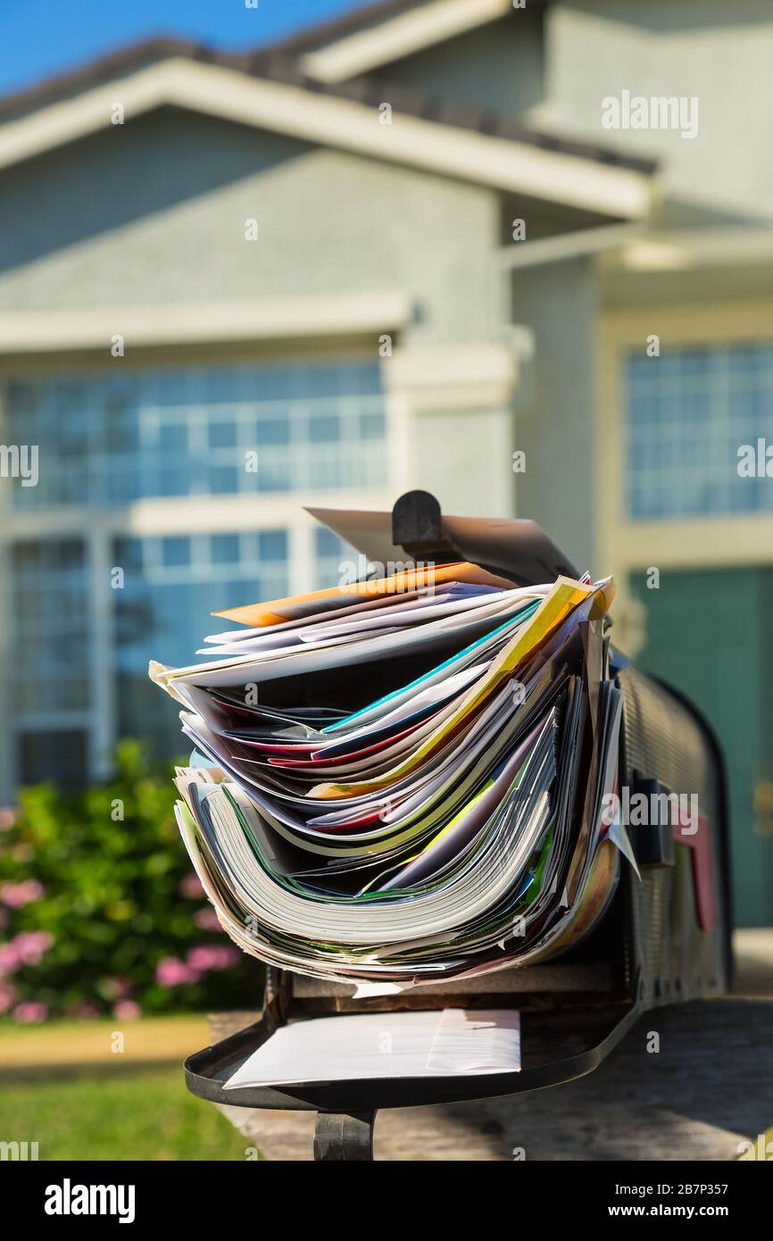 Mail box full of junk mails Stock Photo - Alamy