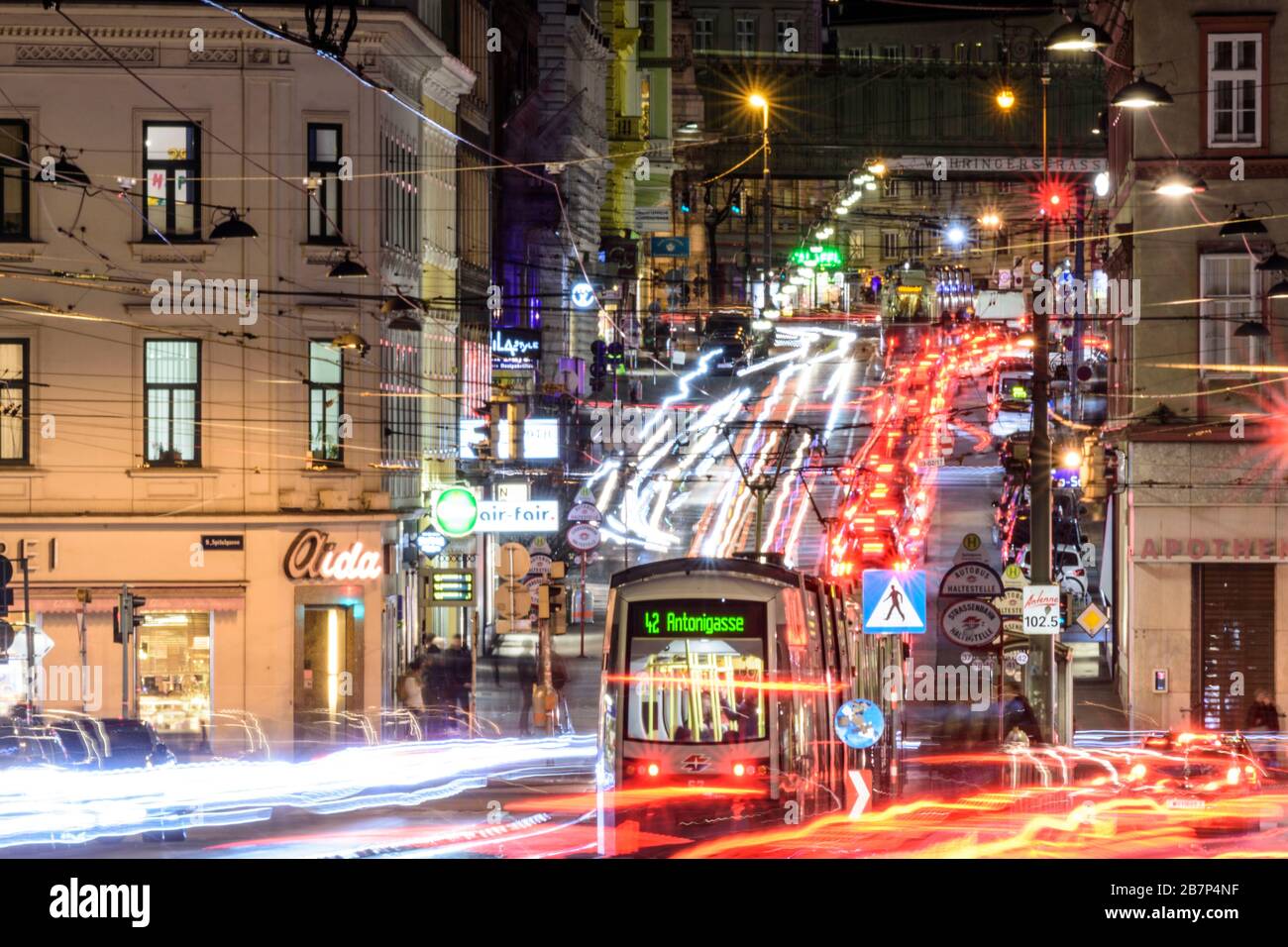 Wien, Vienna: streetcar, cars, car light trails, heavy traffic, rush ...