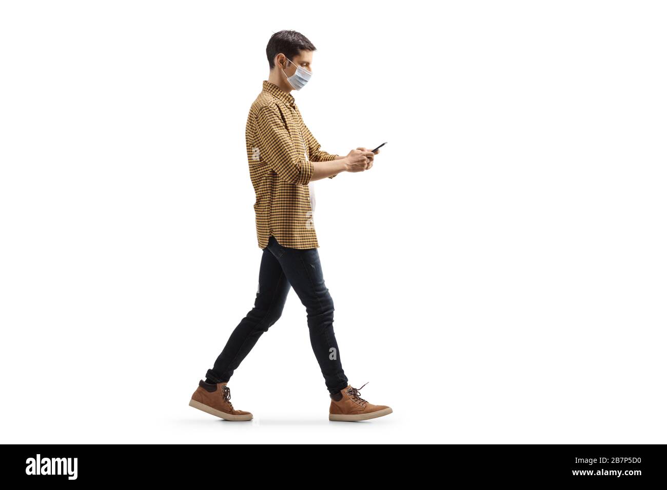 Person wearing a mask walking Cut Out Stock Images & Pictures - Alamy