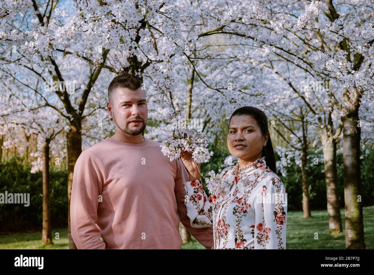 Couple relax in the park during Spring in Amsterdam Netherlands ...