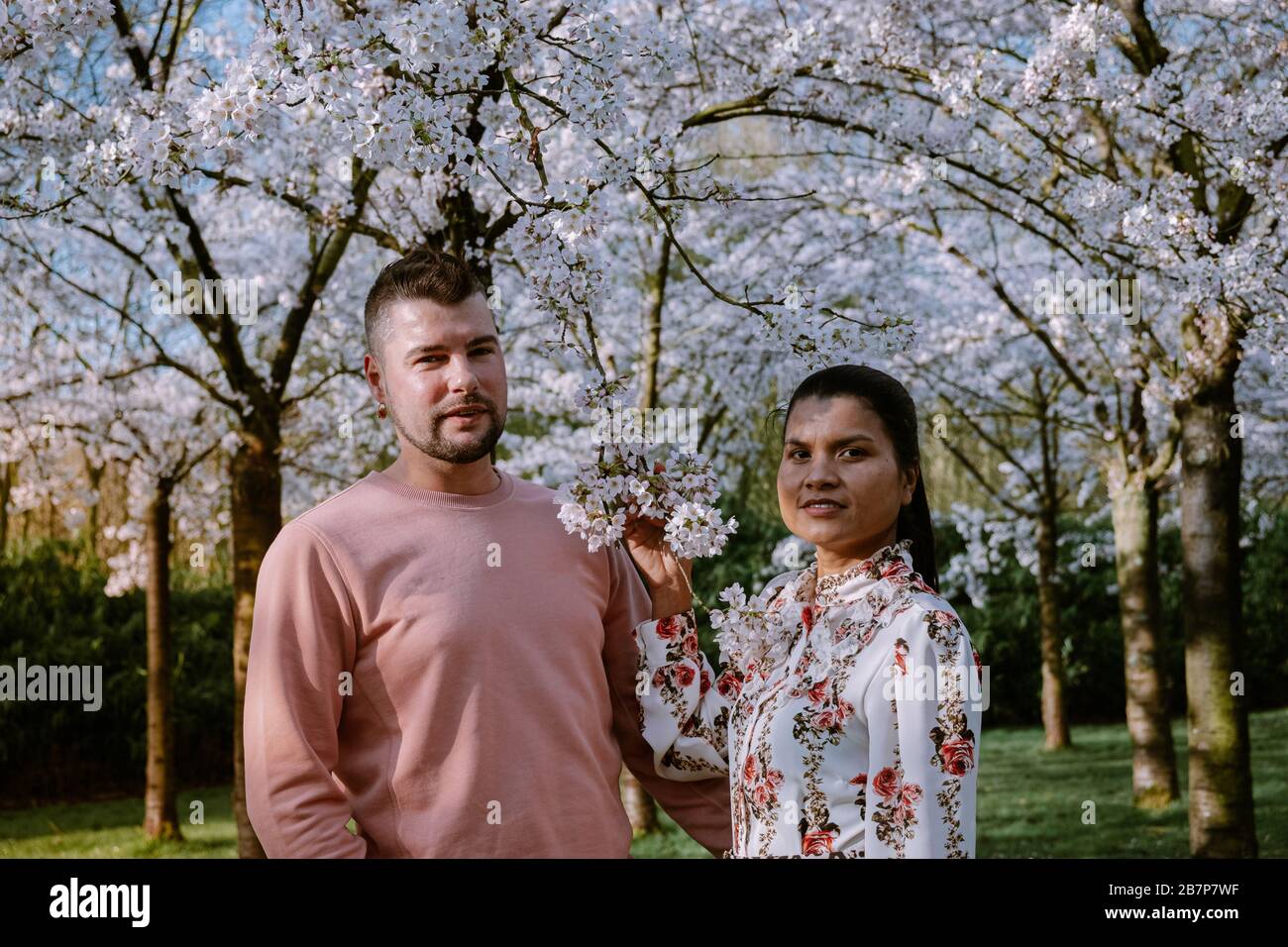 Couple relax in the park during Spring in Amsterdam Netherlands ...