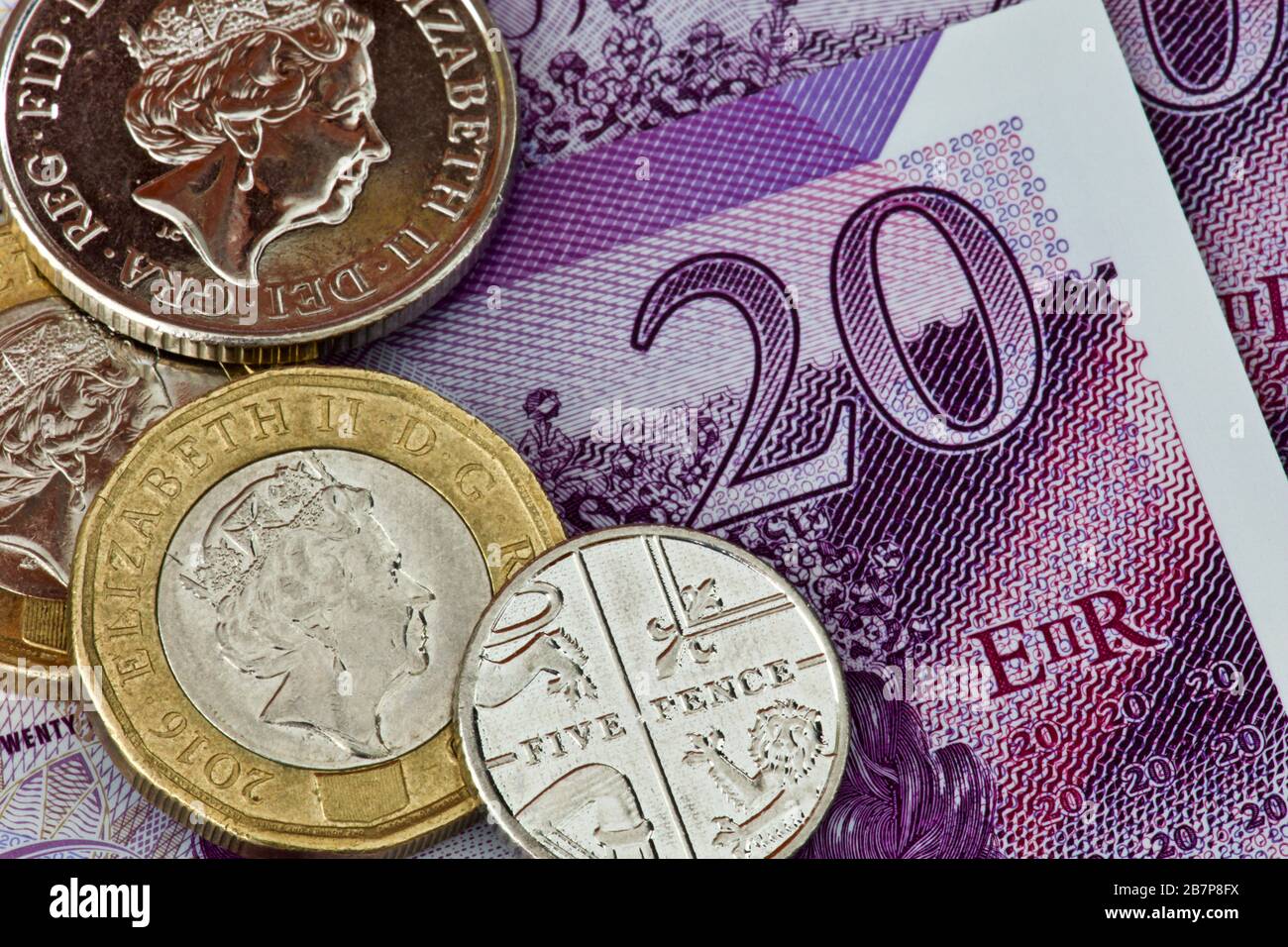 British coins on the new 2020 polymer £20 banknotes Stock Photo - Alamy