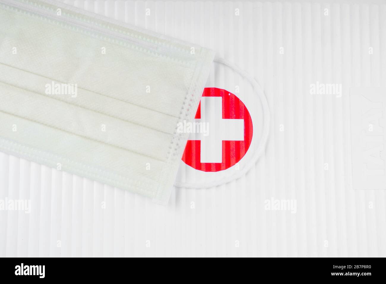 Medical masks on first aid kit box with red cross, protection concept ...