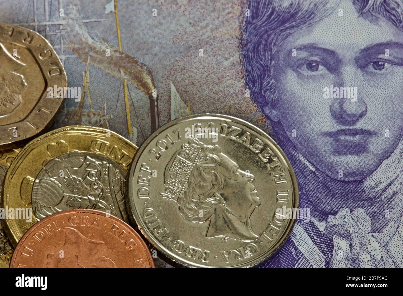 British coins on the new 2020 polymer £20 banknotes Stock Photo - Alamy