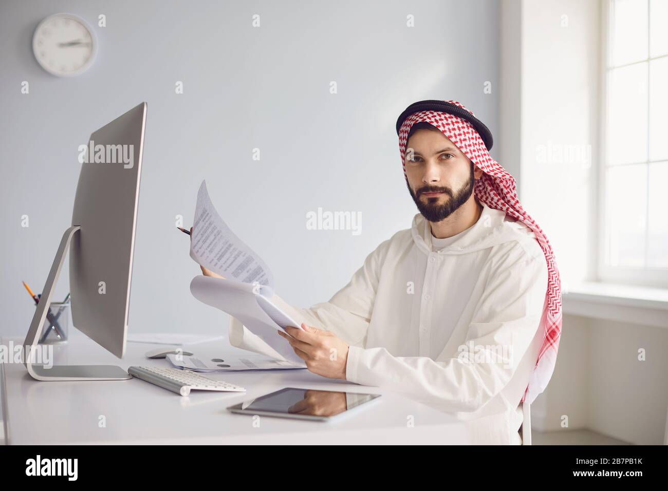 Arab businessman worker works in computer on the workplace in the ...