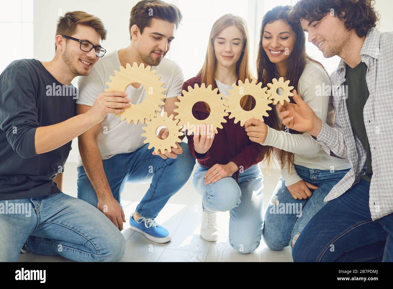 Gears team teamwork cogs cog hi-res stock photography and images - Alamy
