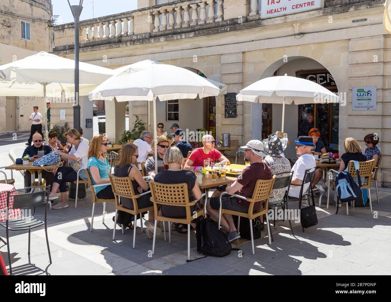 People eating and drinking outdoors at a cafe, Rabat, Malta Stock Photo ...