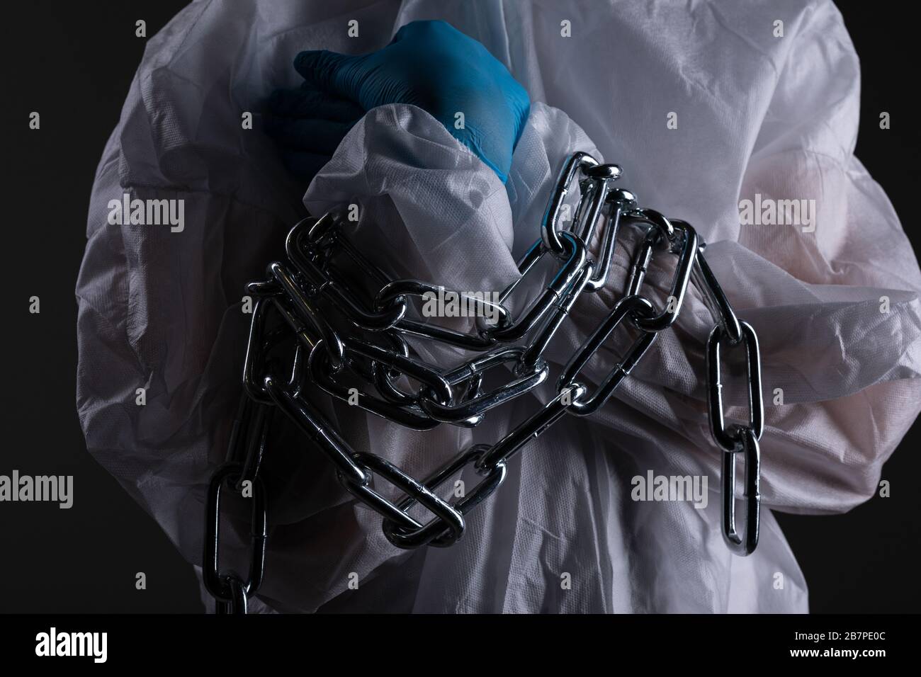doctor with chain-bound hands, coronavirus concept. Epidemic virus ...