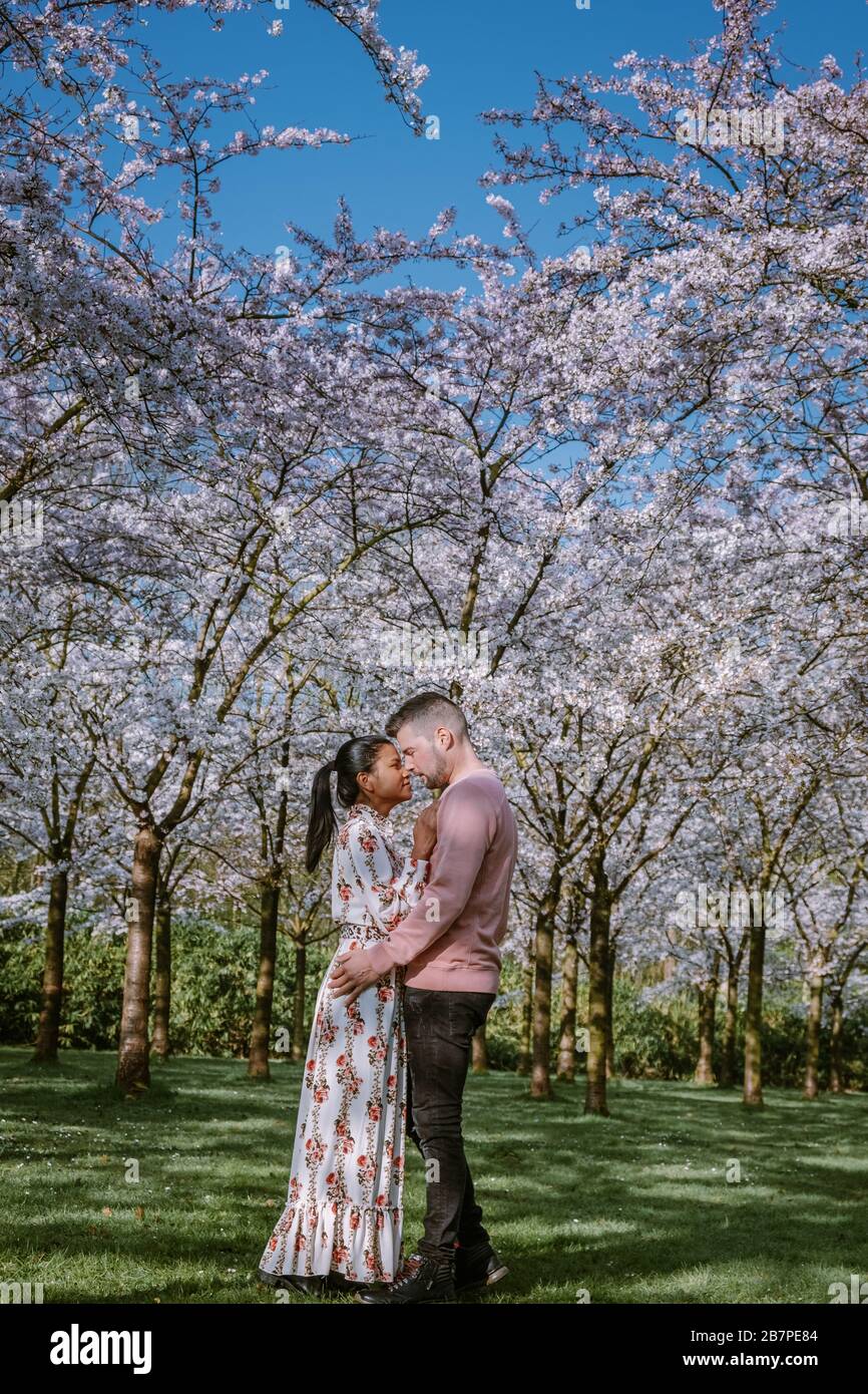 Couple relax in the park during Spring in Amsterdam Netherlands ...