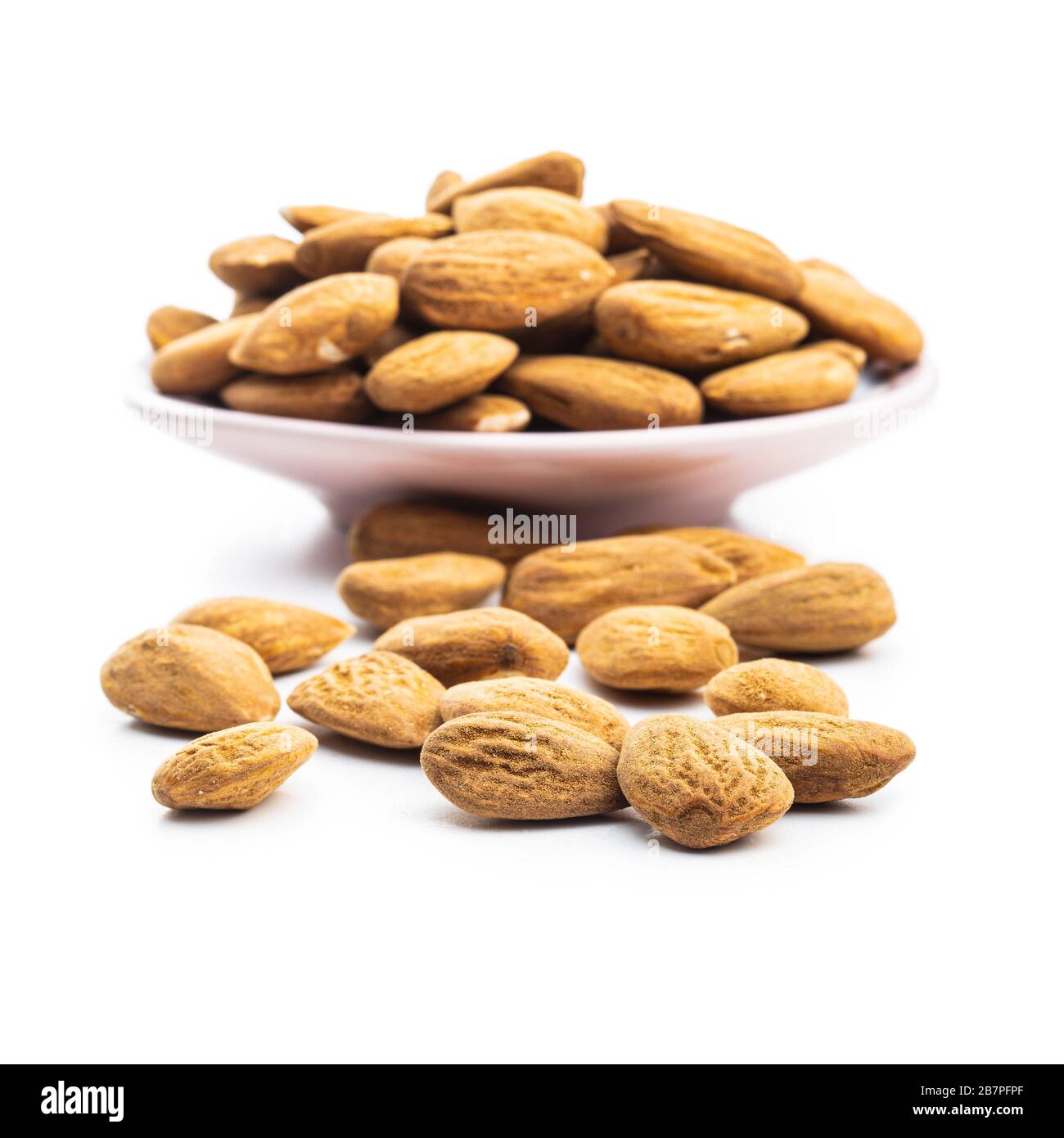 Dried almonds nuts isolated on white background Stock Photo - Alamy
