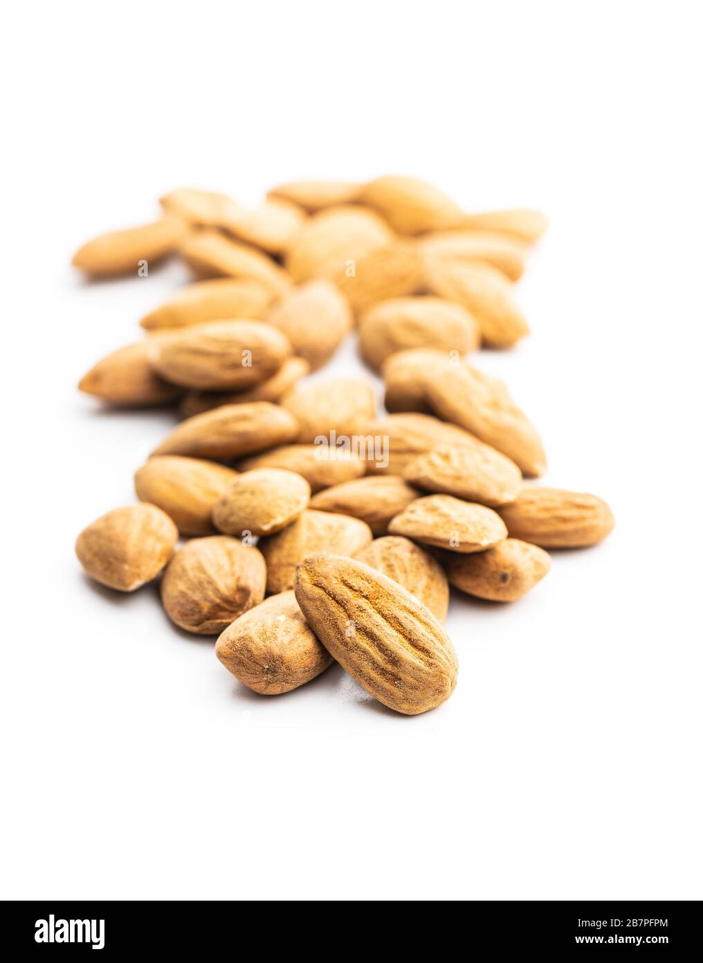 Dried almonds nuts isolated on white background Stock Photo - Alamy