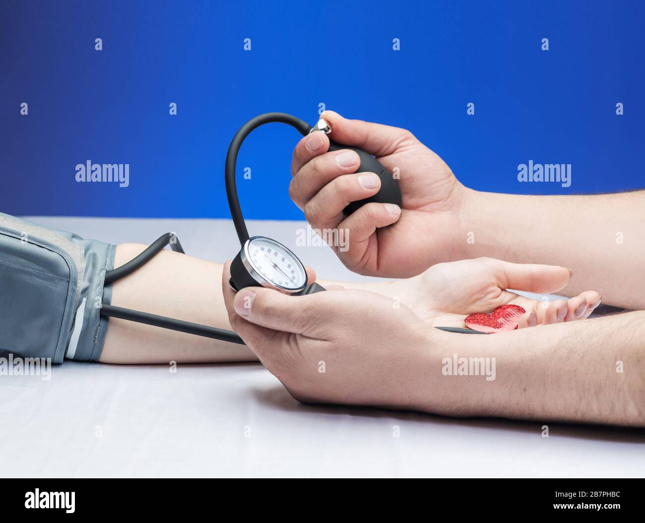 tonometer measures the pressure of woman a doctor appointment Stock ...