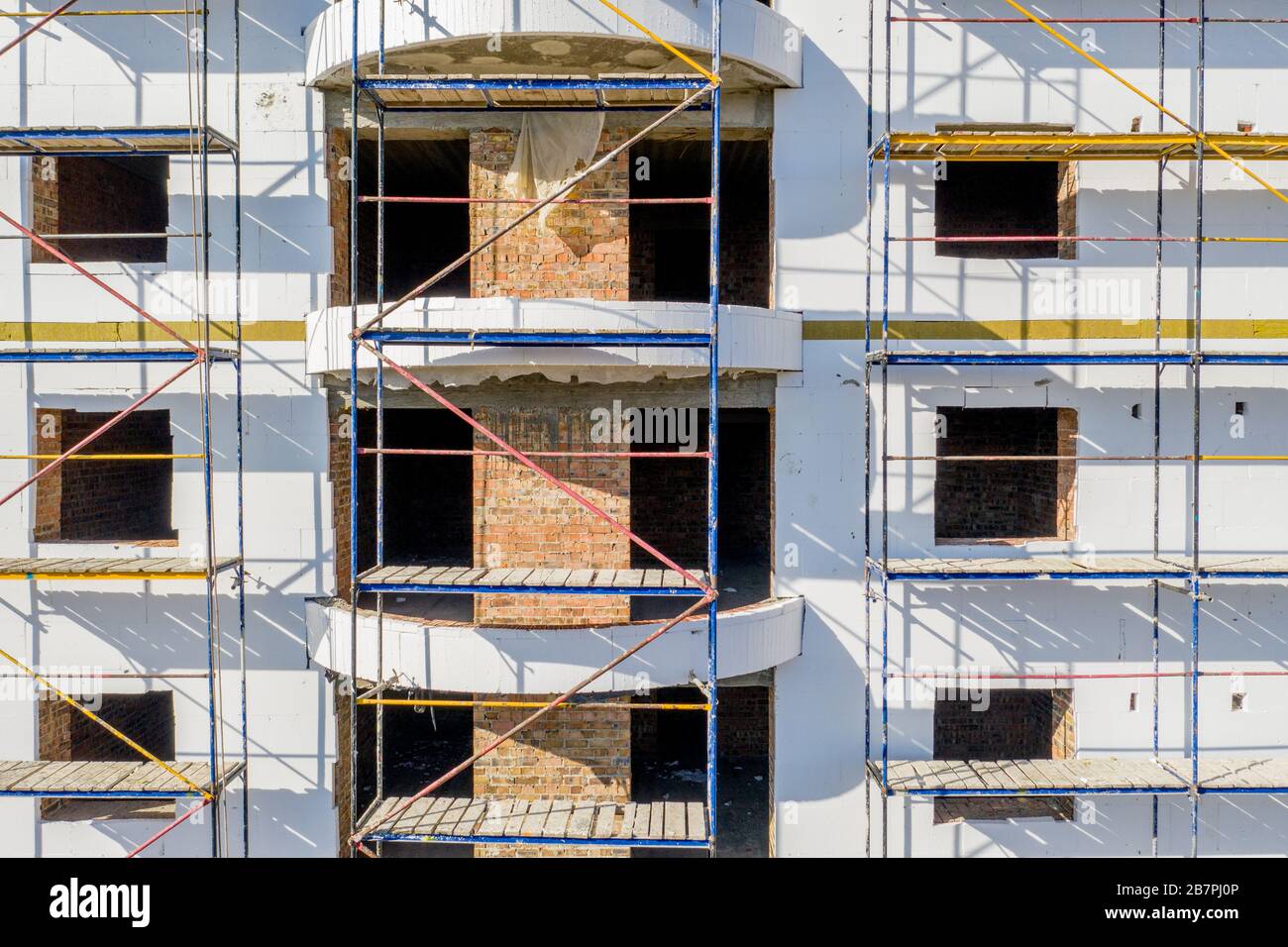 scaffold near the high-rise building for plaster Stock Photo - Alamy