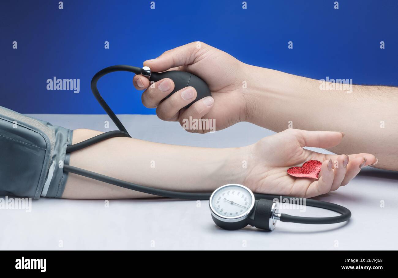 tonometer measures the pressure of woman a doctor appointment Stock ...