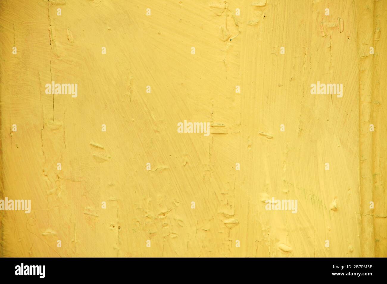Bright yellow old ragged wall closeup background Stock Photo - Alamy