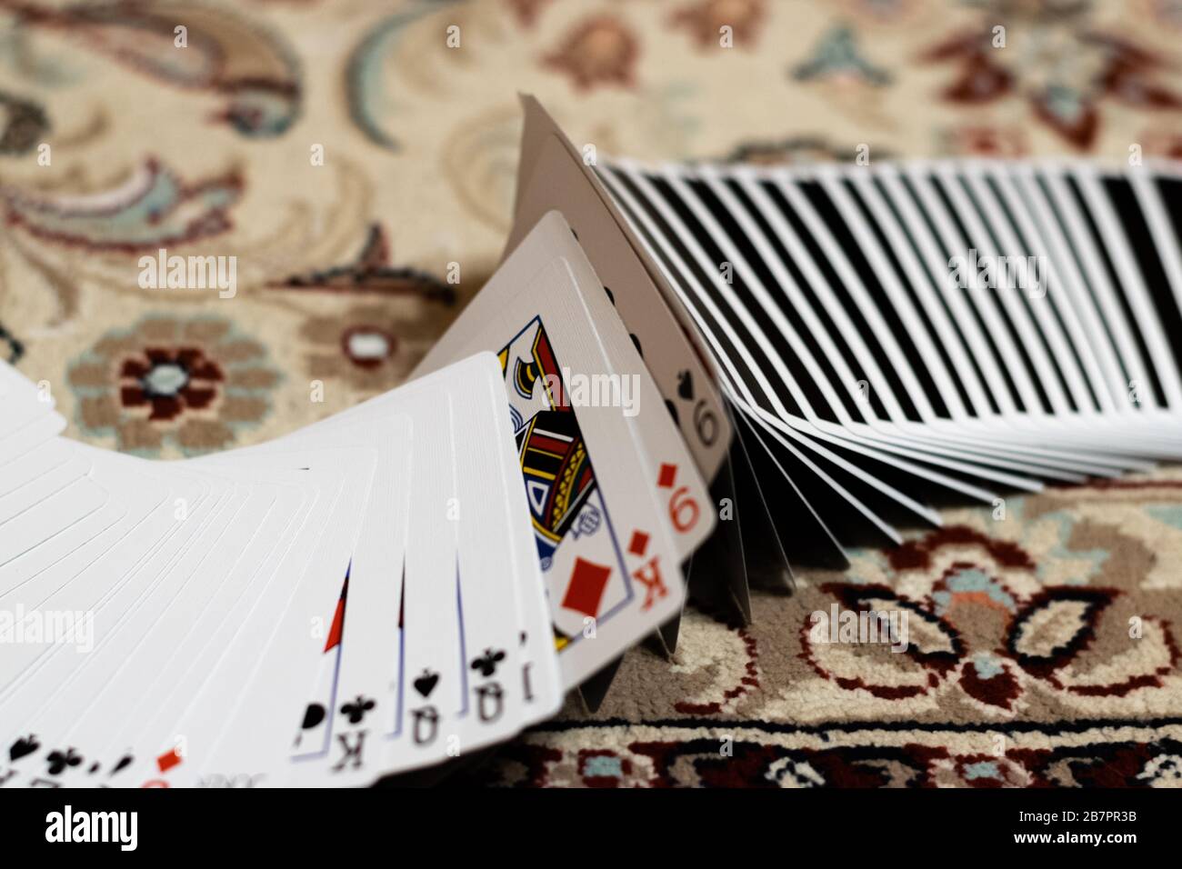 A deck of playing cards arranged like if doing a ribbon spread Stock ...