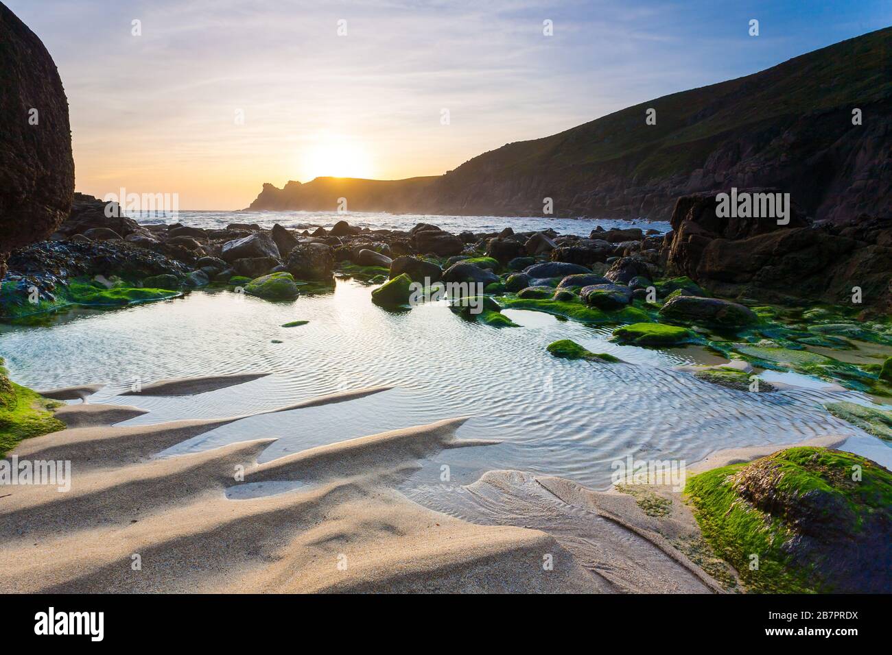 Sunset at Nanjizal, also known as Mill Bay, a beach and cove near Lands ...