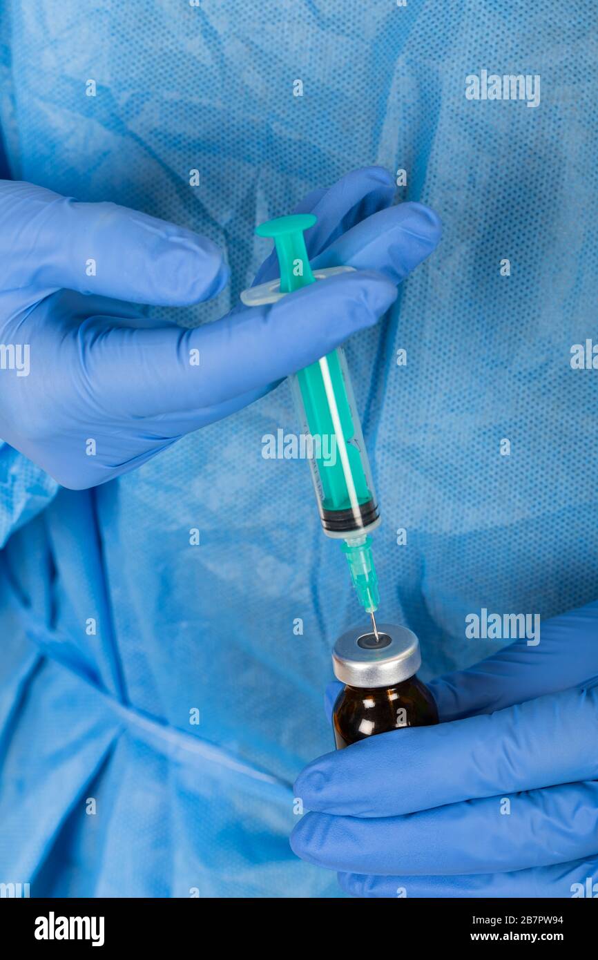 Close up picture of medical surgeon with protective uniform and gloves ...