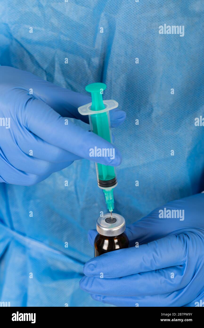 Close up picture of medical surgeon with protective uniform and gloves ...