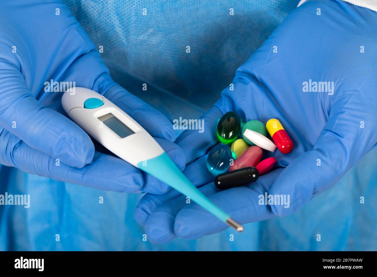Close up picture of surgeon holding digital thermometer and medical ...