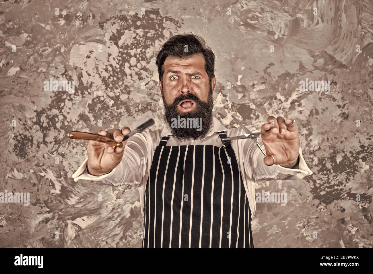 Vintage barber. Taking good care facial hair. Bearded hipster shaving ...