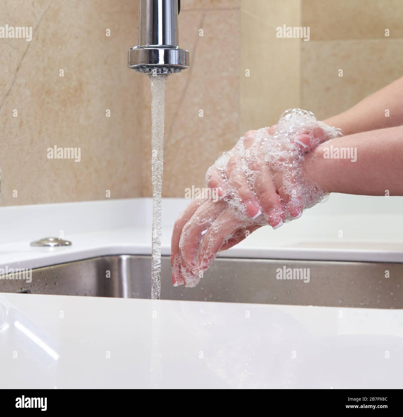 Woman washing hands with antibacterial soap for corona virus prevention ...