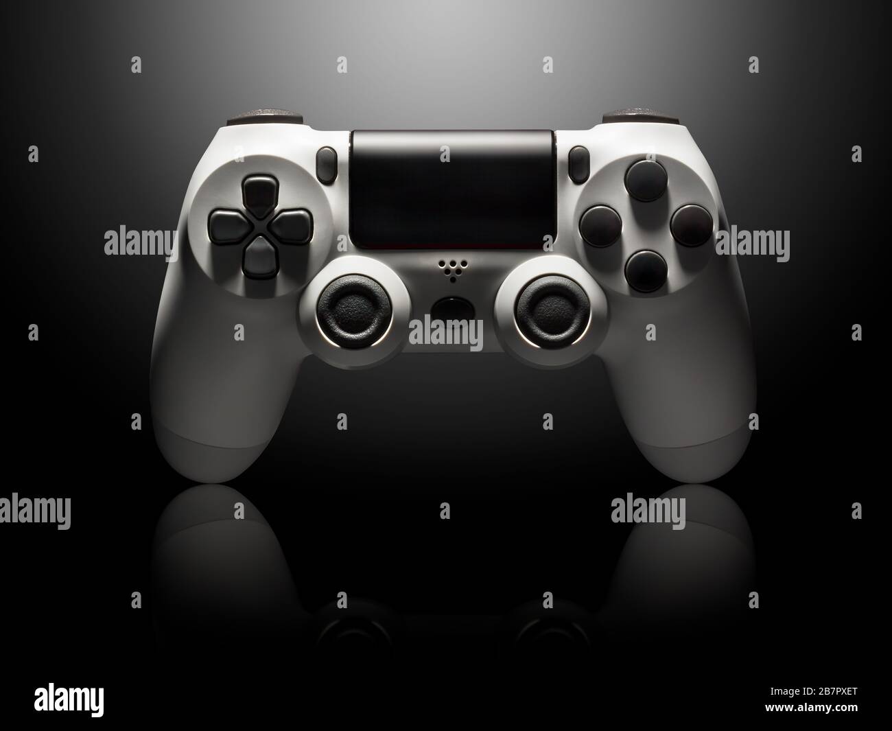 White video game joystick gamepad isolated on a black background Stock ...