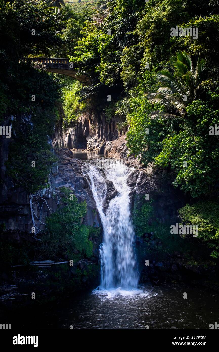 Waterfall pours below bridge at Oheo Gulch in Haleakala National Park ...