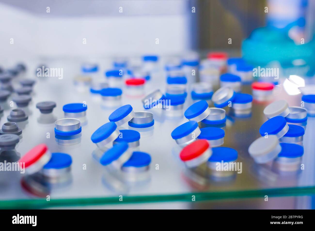 Caps for medical glass bottles in showcase at pharmaceutical exhibition ...