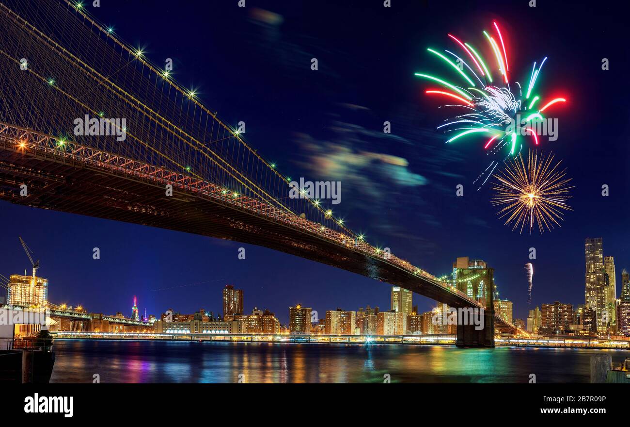 Firework over city at night with reflection in water Fireworks on the ...