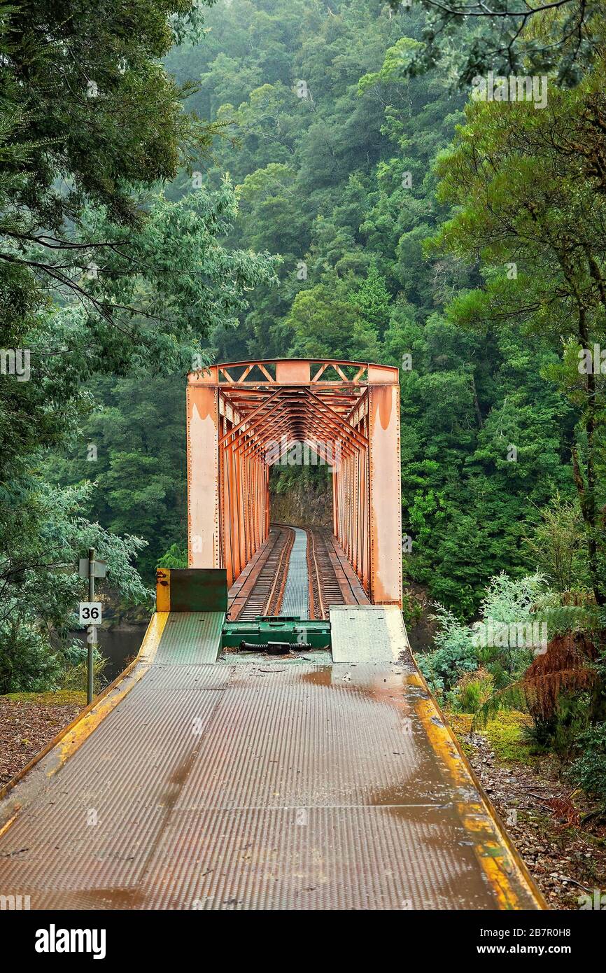 A steel bridge railway crossing over a creek on the route of the West ...