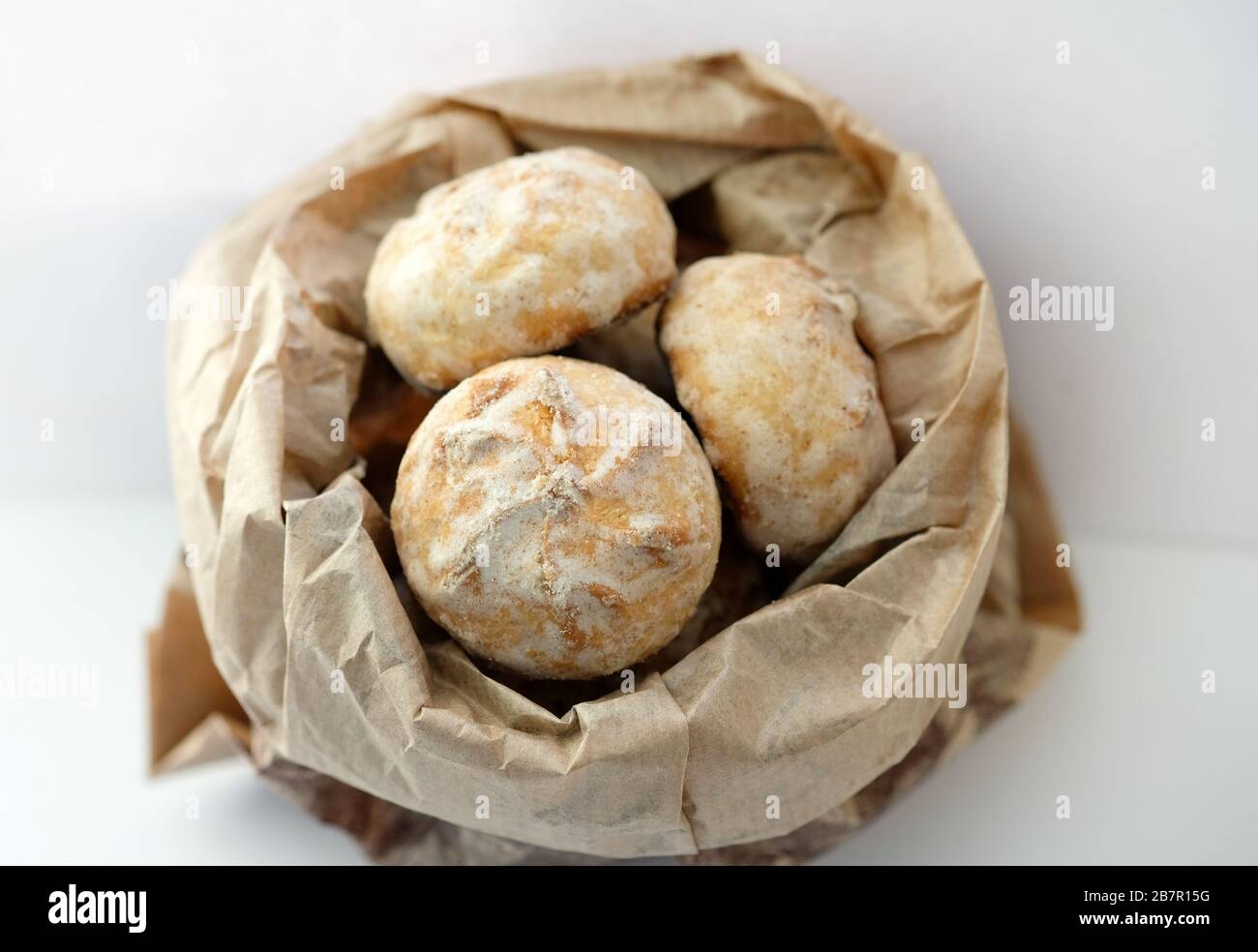 Biscuits in a paper bag on a white background. Stuffed gingerbread ...