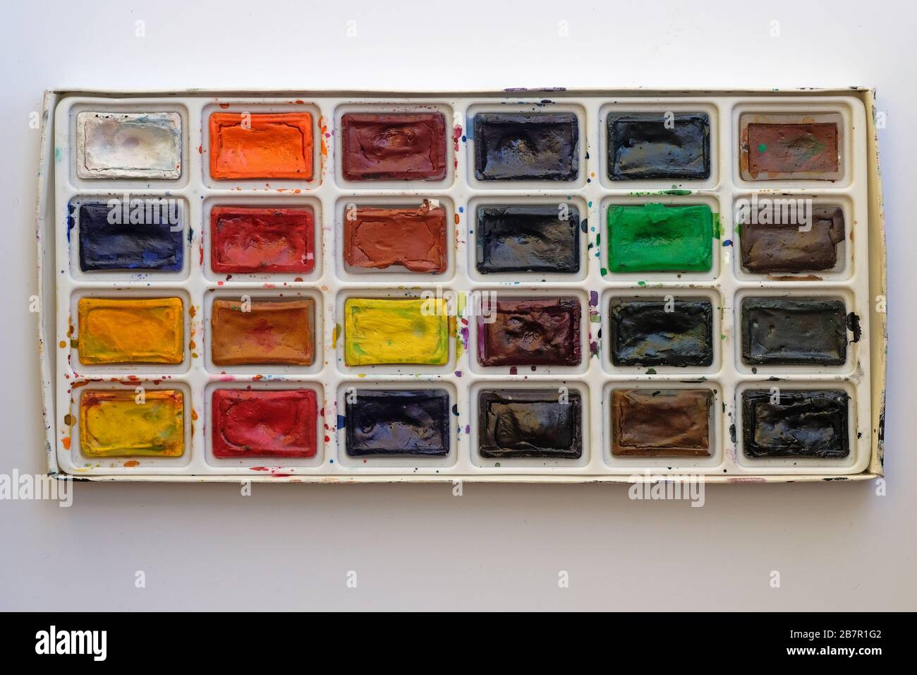 Sets of art paints in a plastic box top view. Watercolor paints in the ...