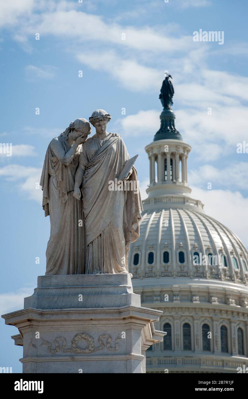 With the US Capitol in the background, the Peace Monument stands above ...