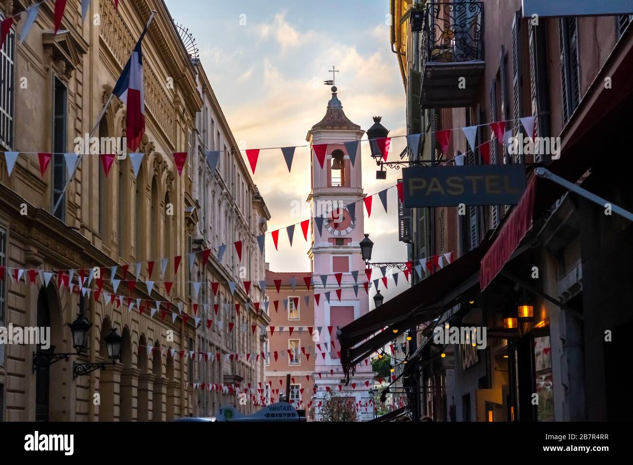 Flags are draped across one of the streets in Old Town with the Rusca ...