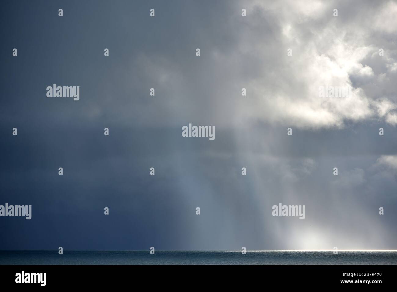 Squally rain shower at sea Stock Photo - Alamy