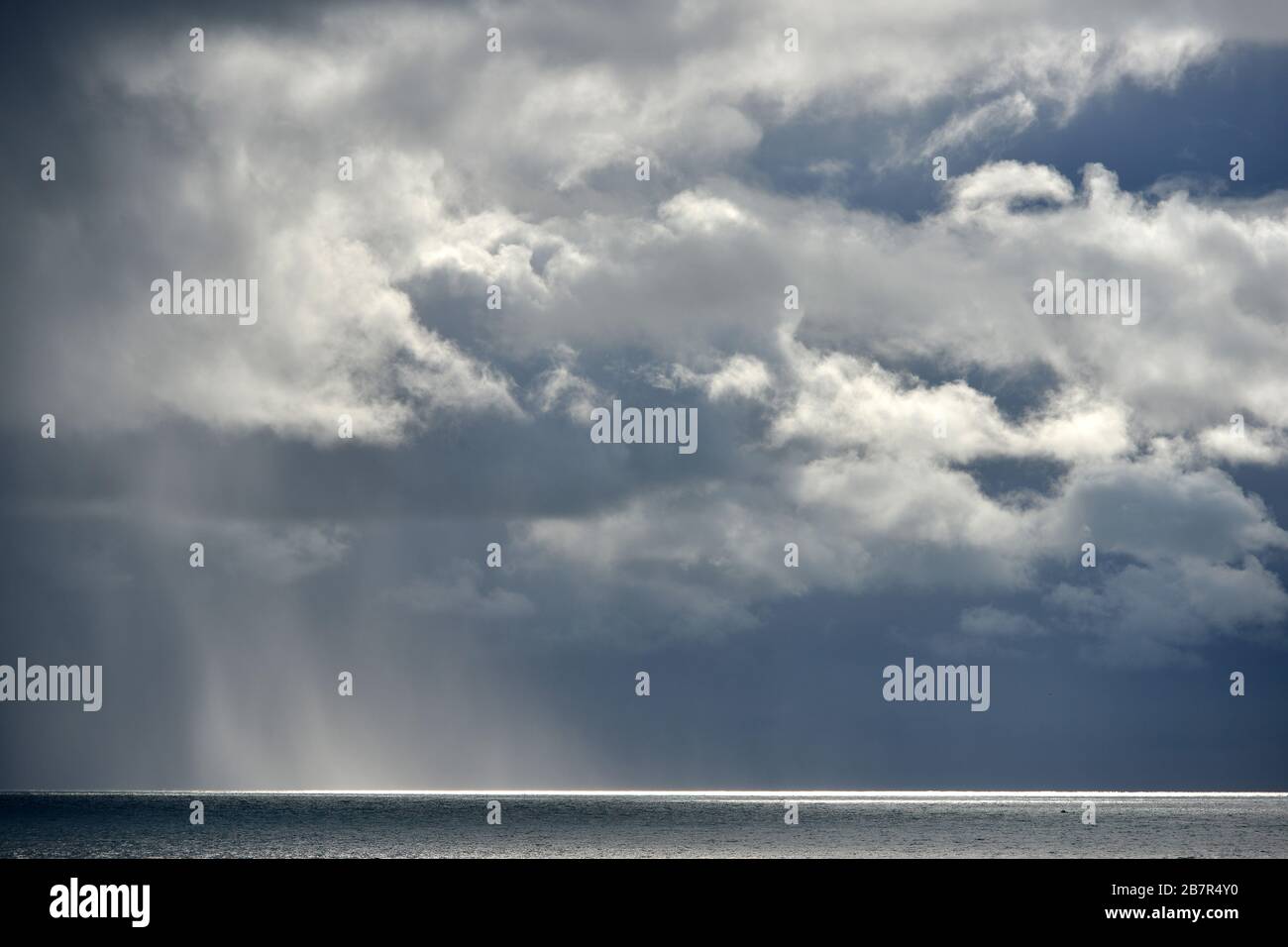 Squally rain shower at sea Stock Photo - Alamy