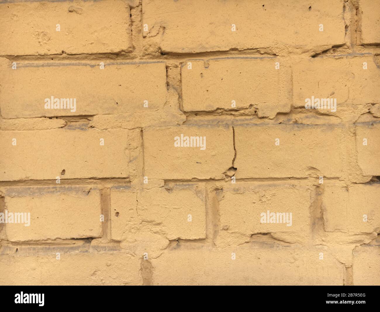 Yellow brick wall Stock Photo - Alamy
