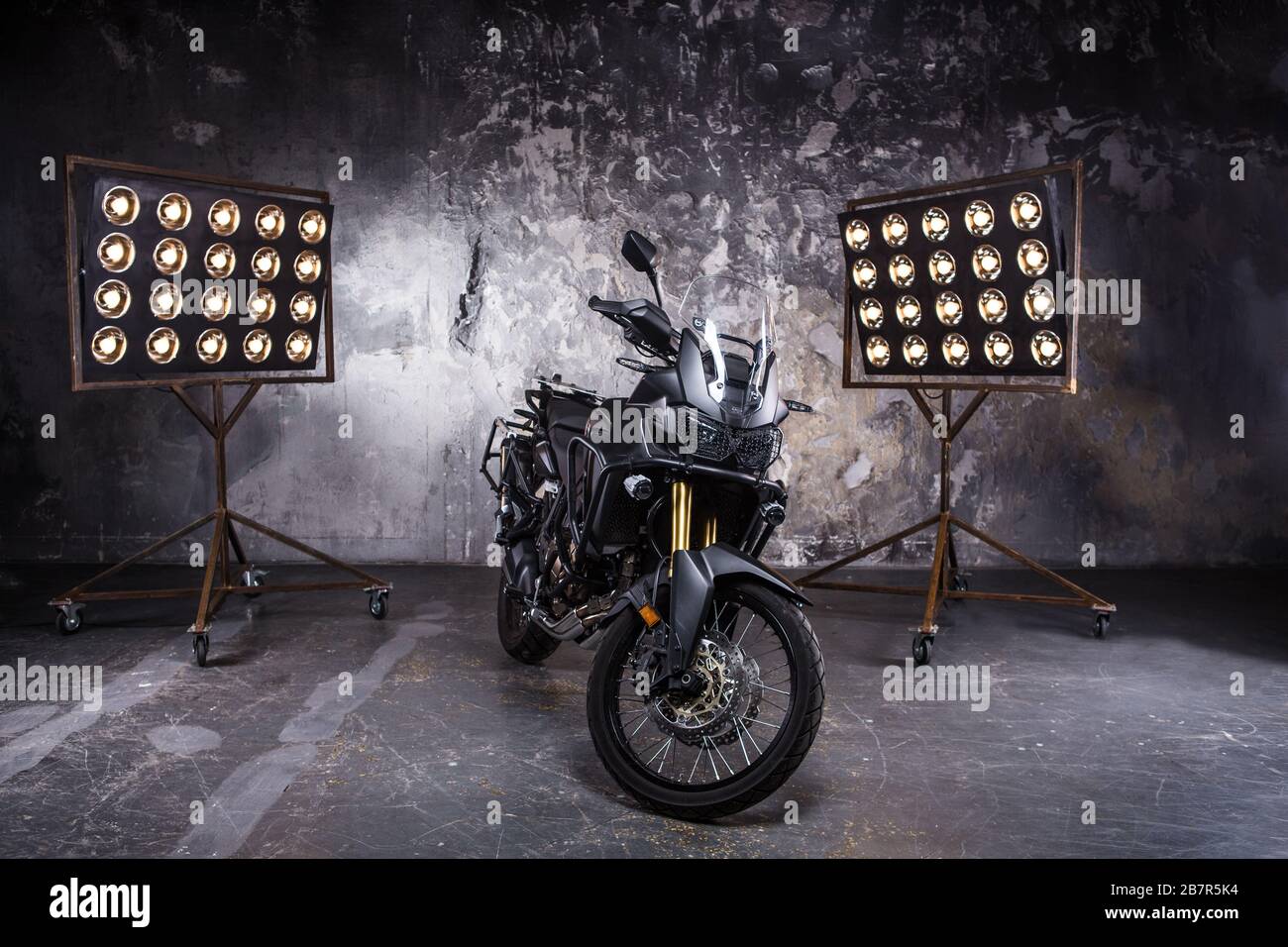 black motorcycle in the interior inside with yellow backlight in the ...
