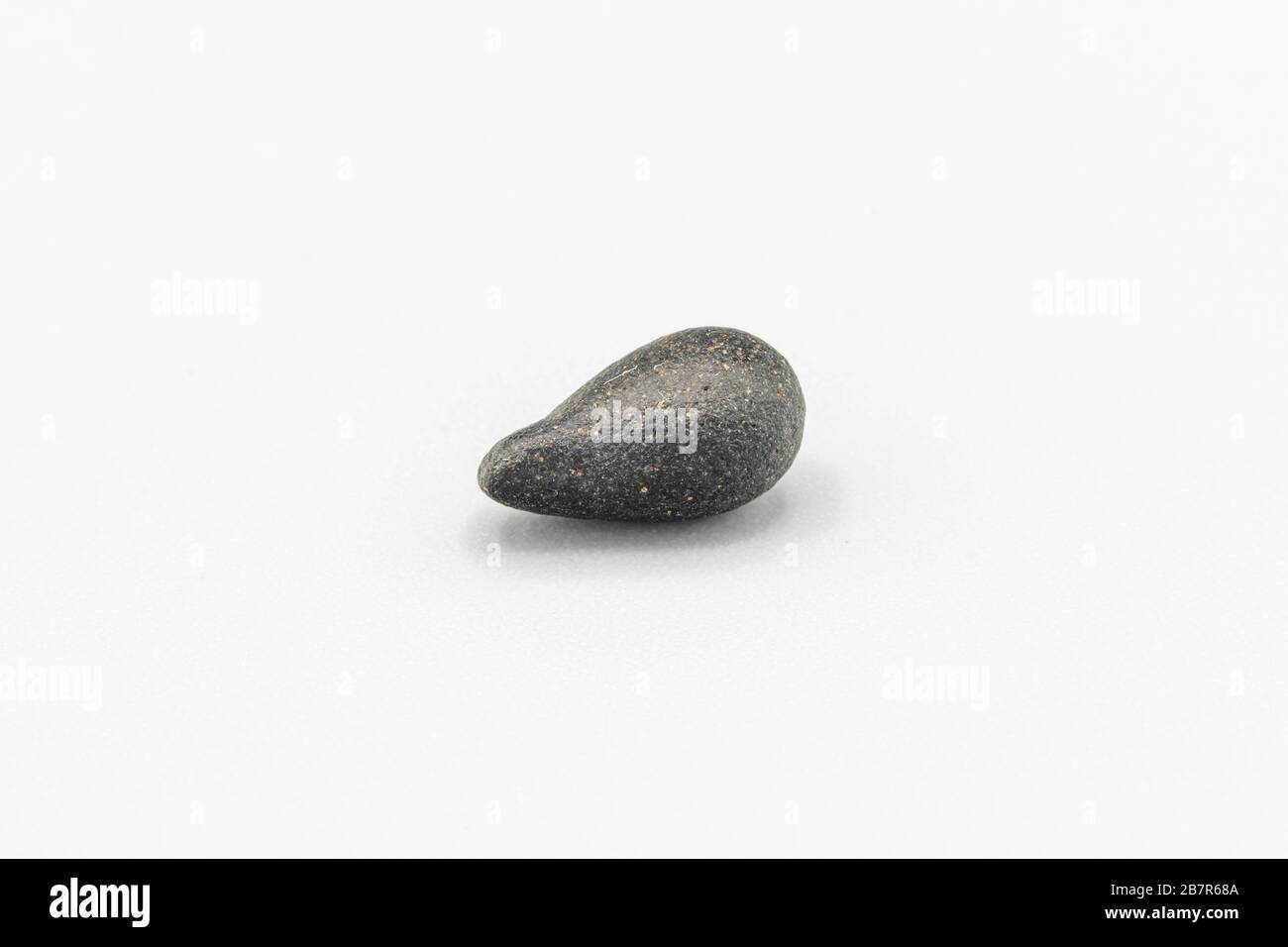 Black magnetic Atacaimite Tektite Meteorite isolated, a rock formed in ...