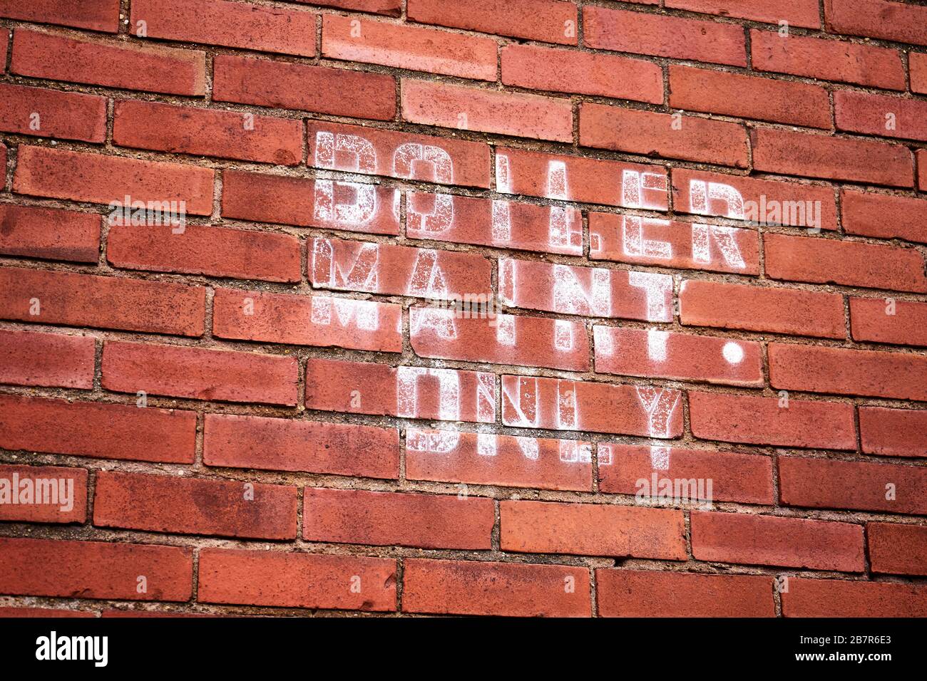 Boiler maintenance sign painted on brick wall Stock Photo - Alamy