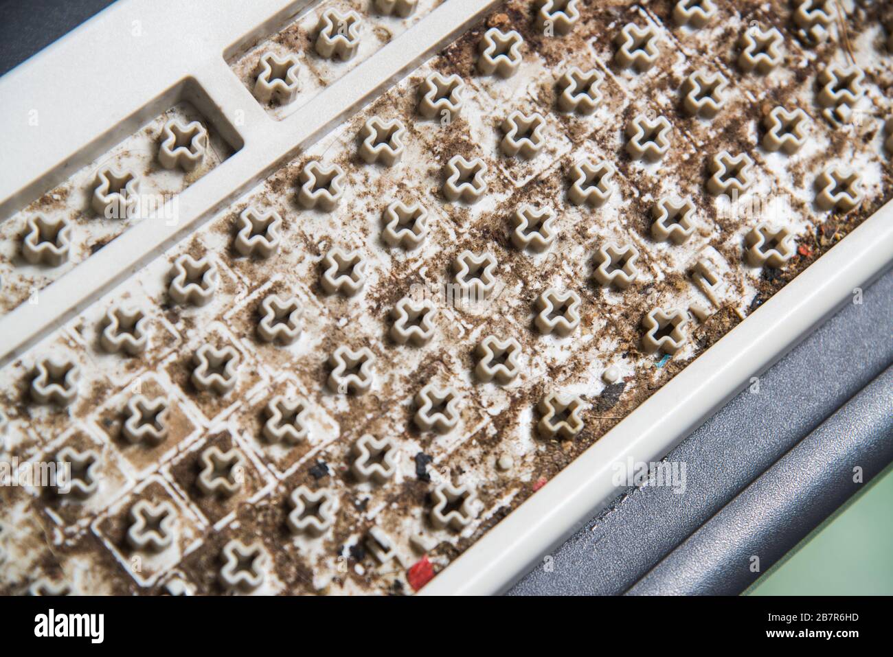 Dirty stain under the keypad of keyboard computer, unsightly and ...