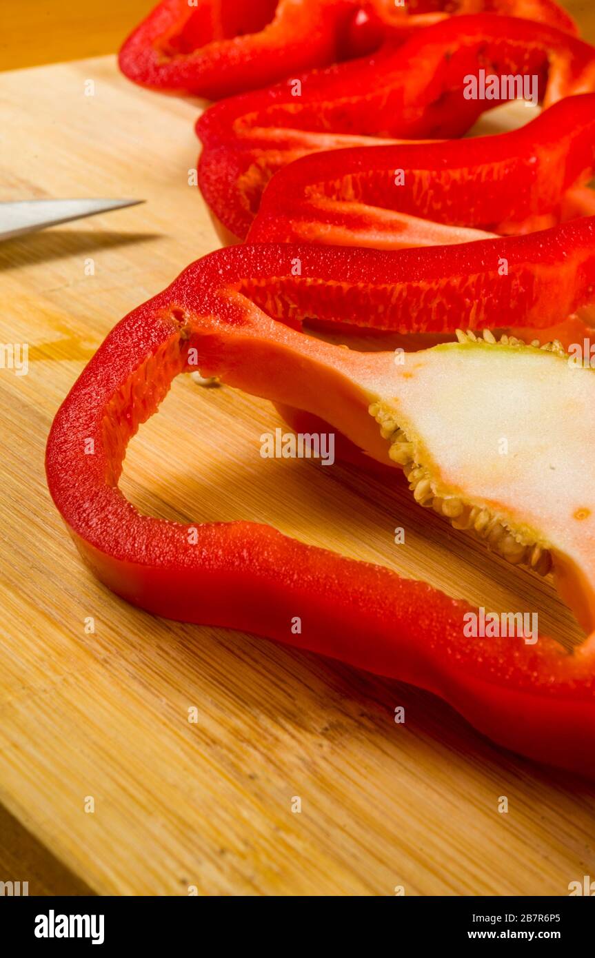 sliced fresh red paprika, bell pepper on bamboo cutting board Stock ...