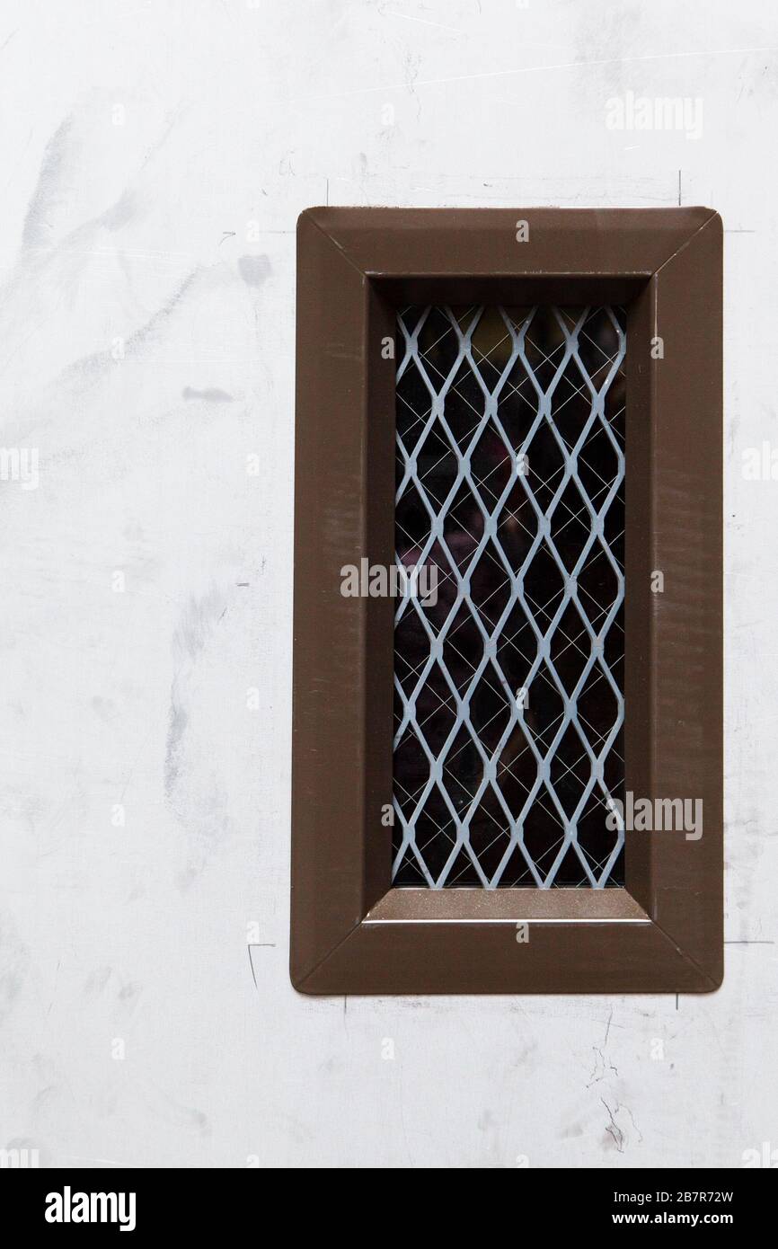 Small Security Window in Door Stock Photo - Alamy